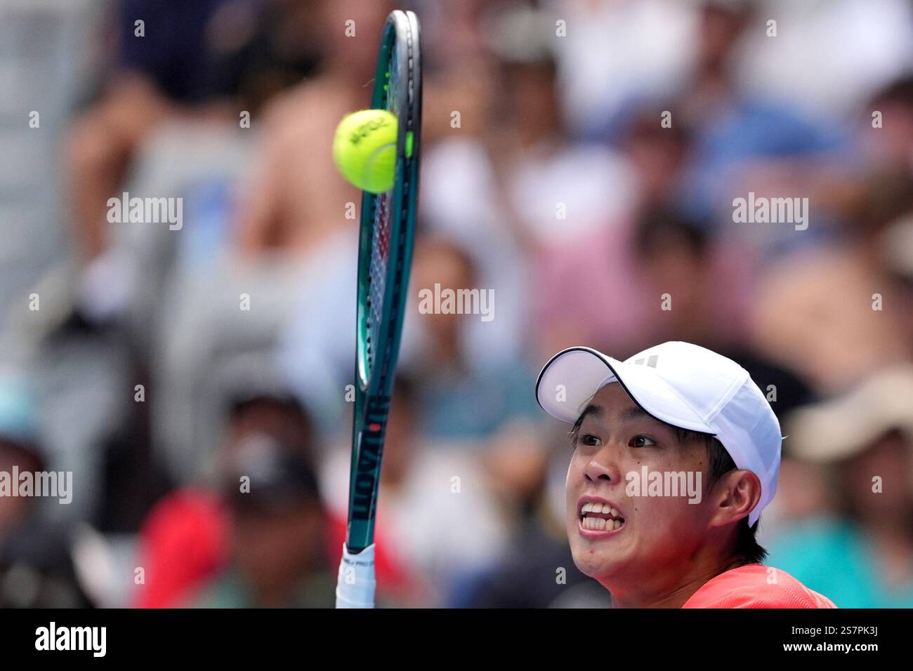 Learner Tien of the U.S. plays a forehand return to Lorenzo Sonego of ...
