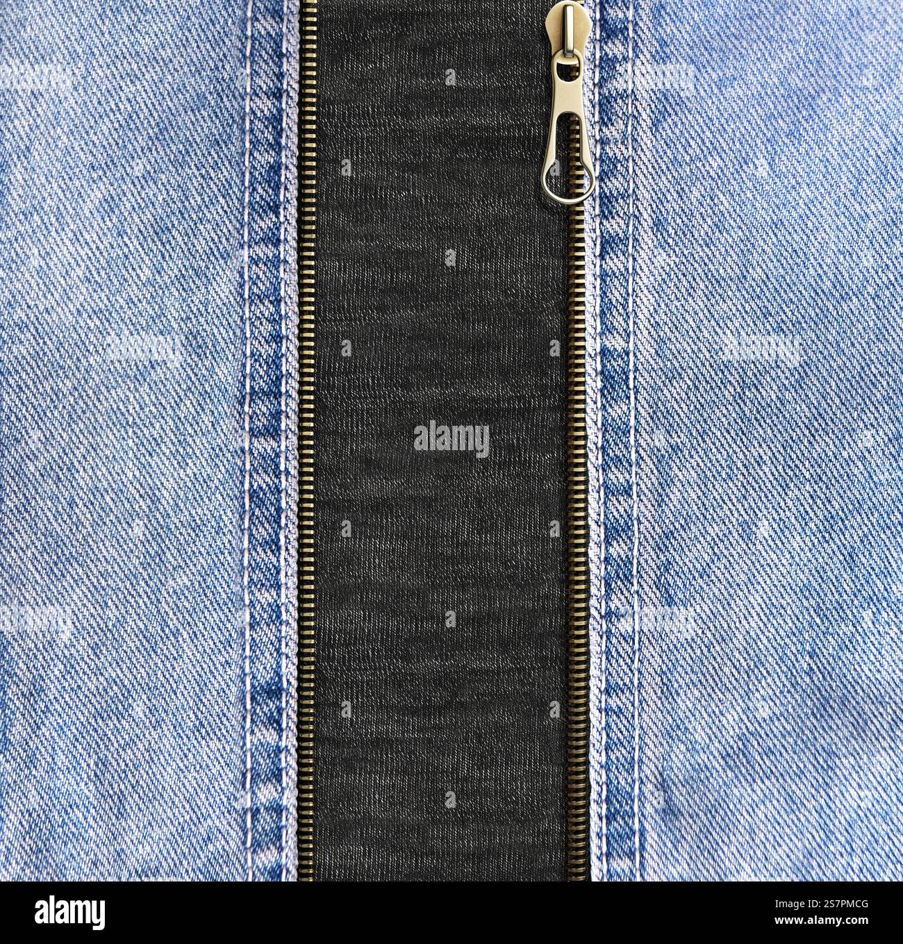 Square background with blue denim borders, zipper opened and black ...