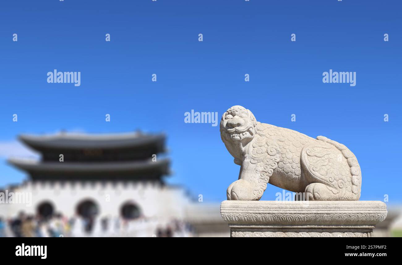 A stone statue of a mythical creature at the Gwanghwamun Gate of ...