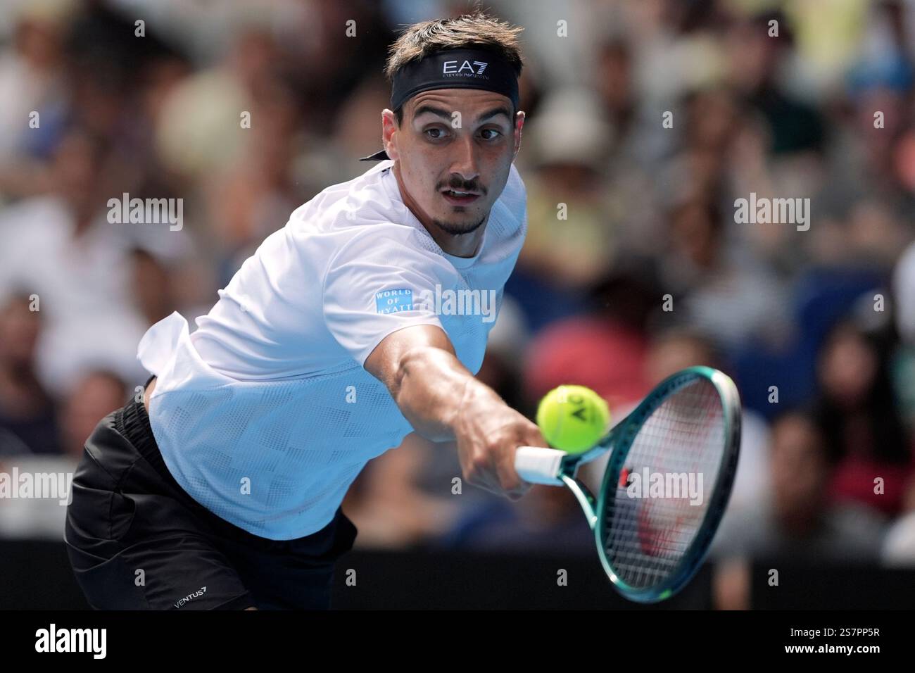 Lorenzo Sonego of Italy plays a backhand return to Learner Tien of the ...