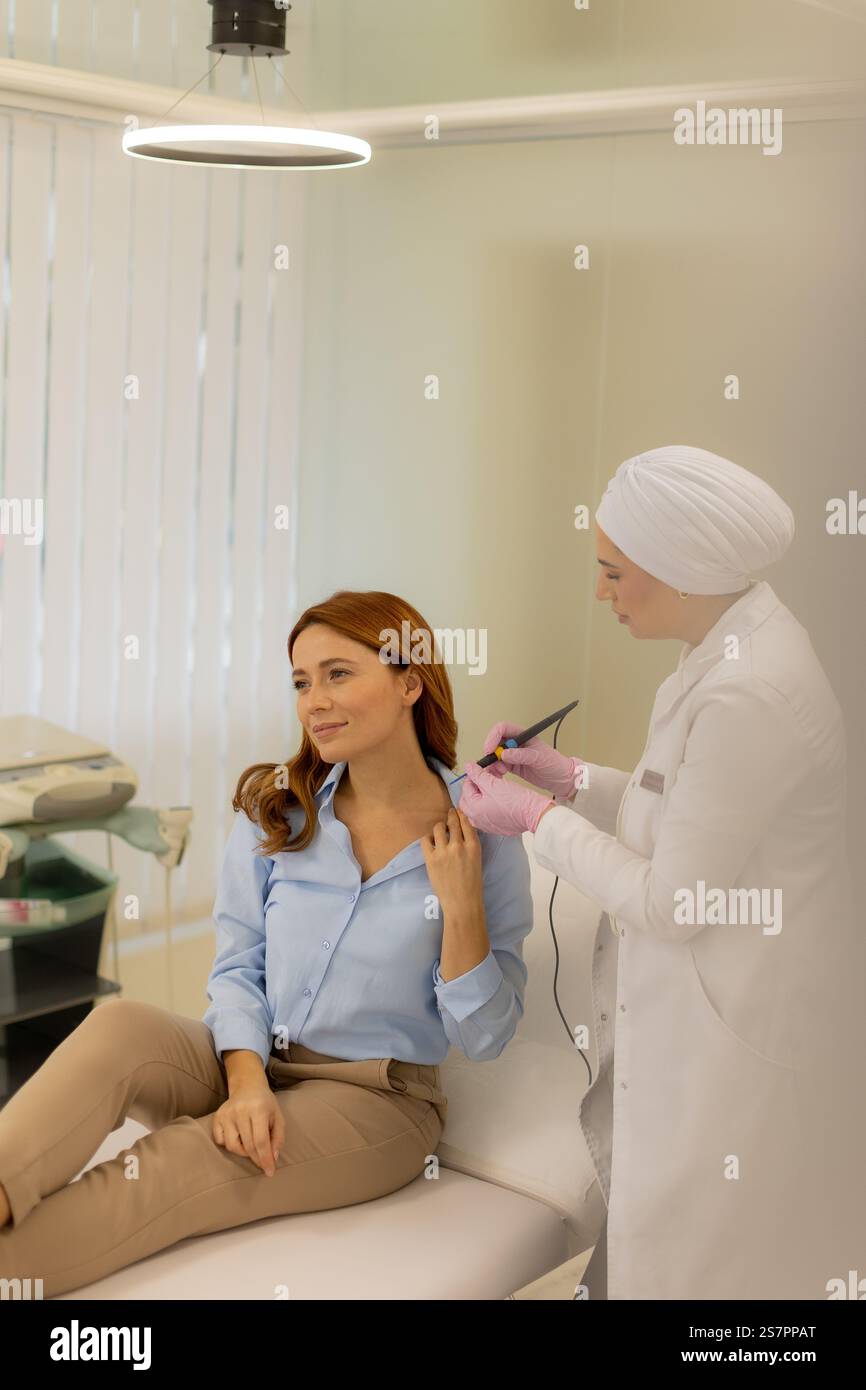 A skilled medical professional performs an electrocautery procedure on ...