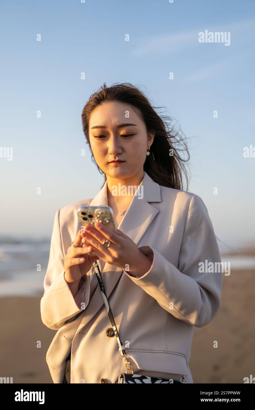 A Japanese woman in her 20s wearing white clothes spending time in the ...