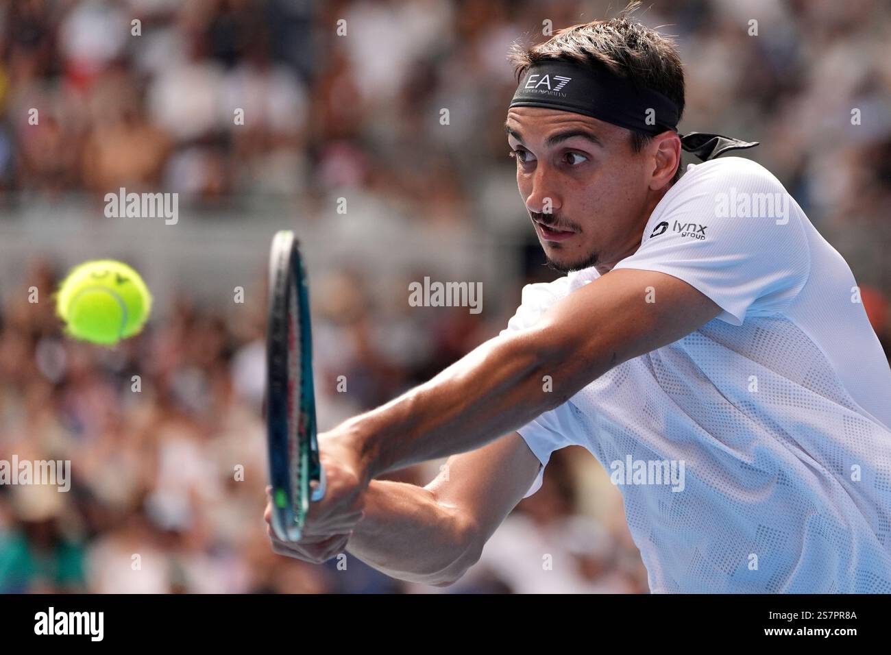 Lorenzo Sonego of Italy plays a backhand return to Learner Tien of the ...