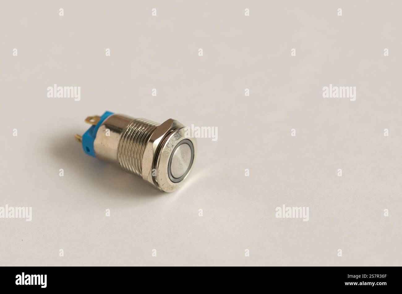 Silver modern computer power button with blue led. Close up Stock Photo ...