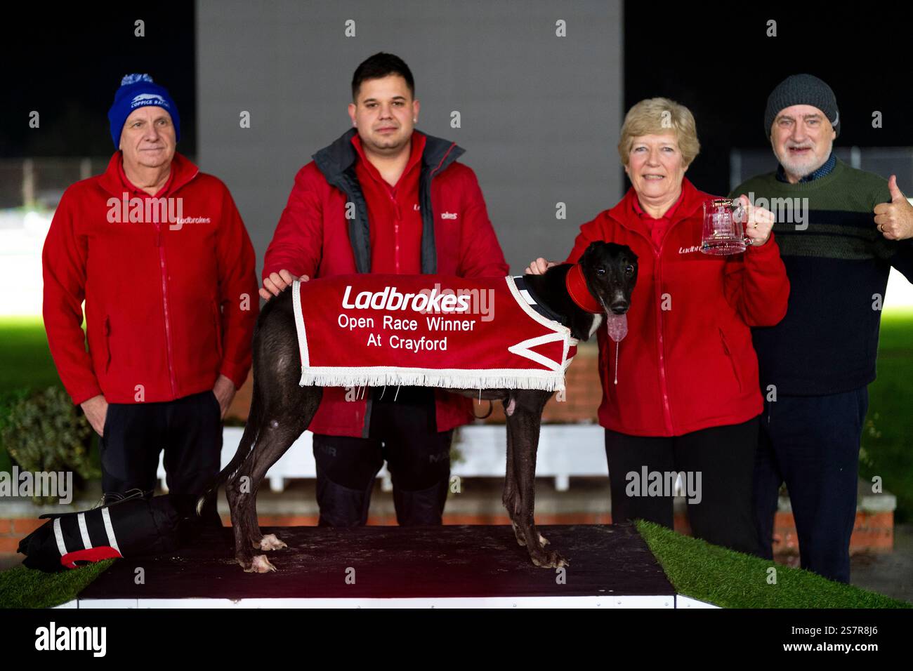 Dog handlers with a winning greyhound during the final night of racing ...
