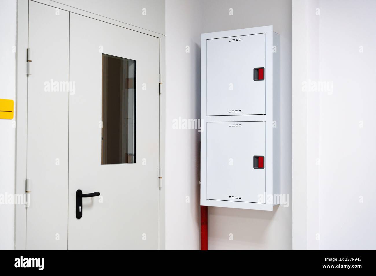 Utility area features safety equipment and a security door in a modern ...