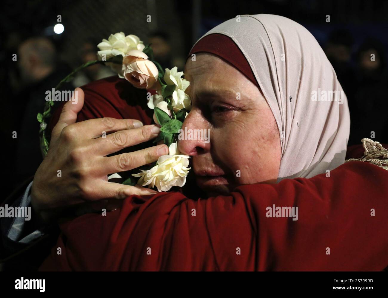 20 January 2025, ---, Beitunia: A Palestinian released prisoner hugs ...