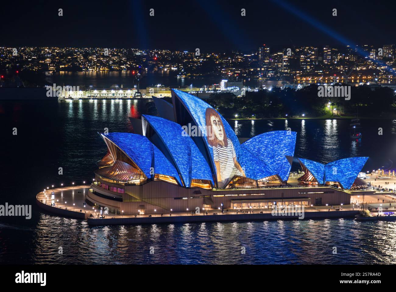 The Sydney Opera House at night, colorfully illuminated with a ...