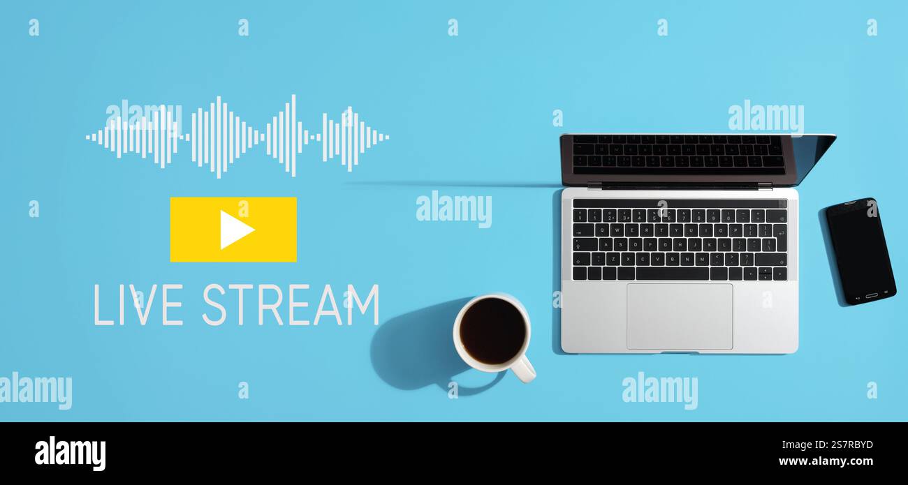 Live stream concept showing a laptop, a smartphone and a cup of coffee ...