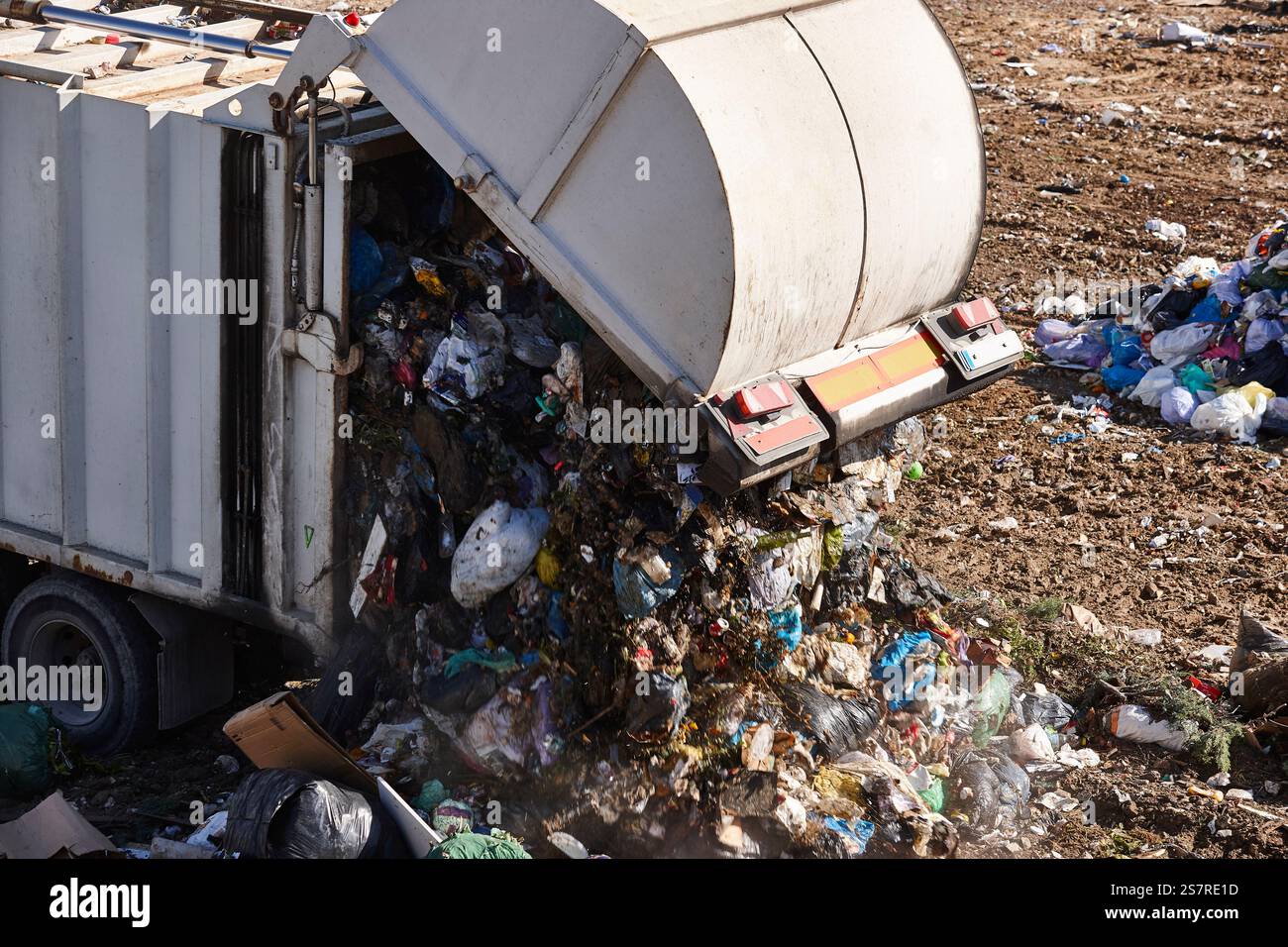 Truck unloading garbage on an open air dump. Waste recycling Stock ...