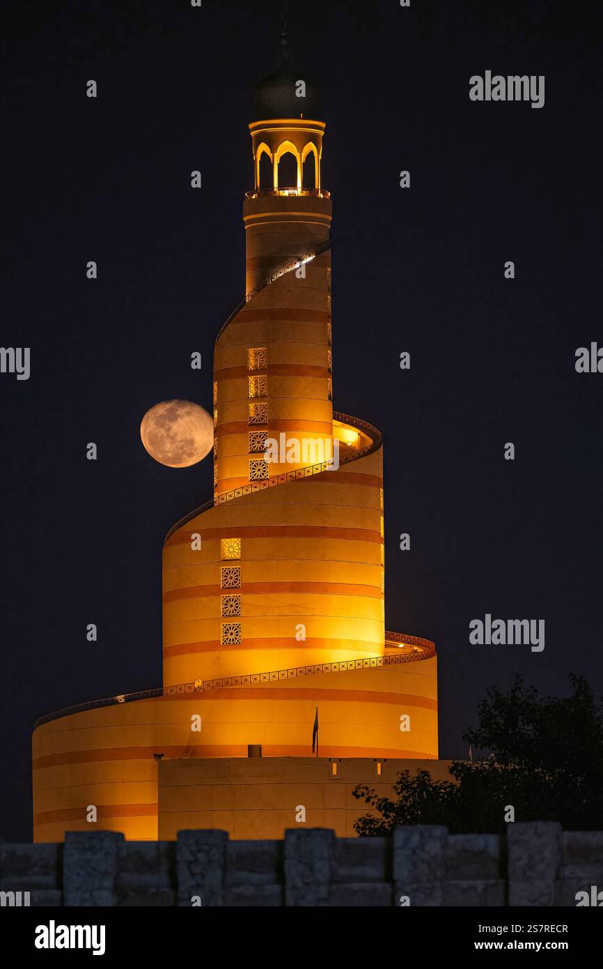 Fanar minaret with the full moon background. Islamic culture center ...