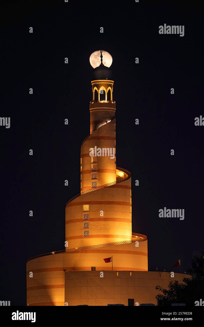 Fanar minaret with the full moon background. Islamic culture center ...