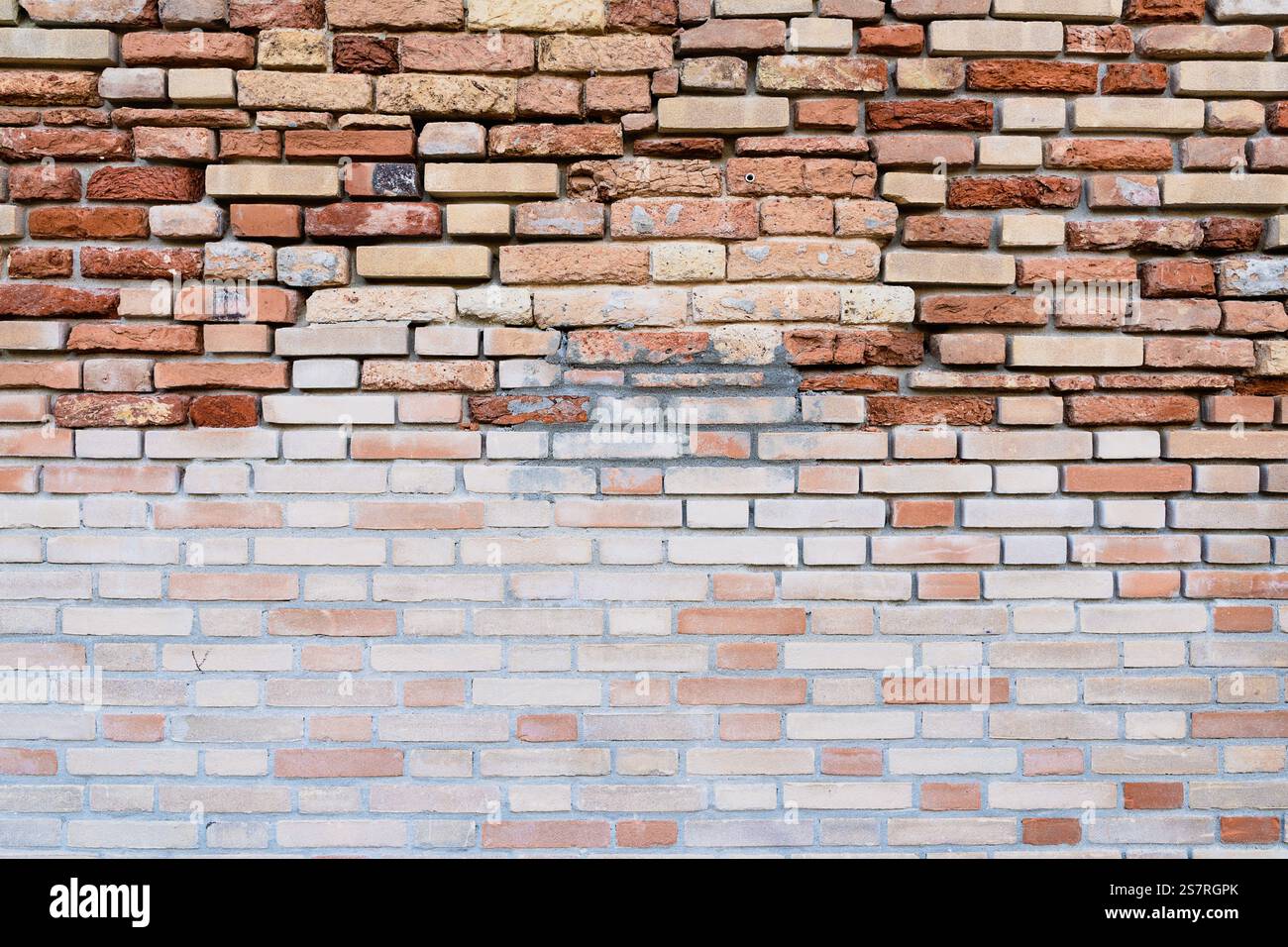 A vintage textured brick wall featuring a gradient pattern of earthy ...