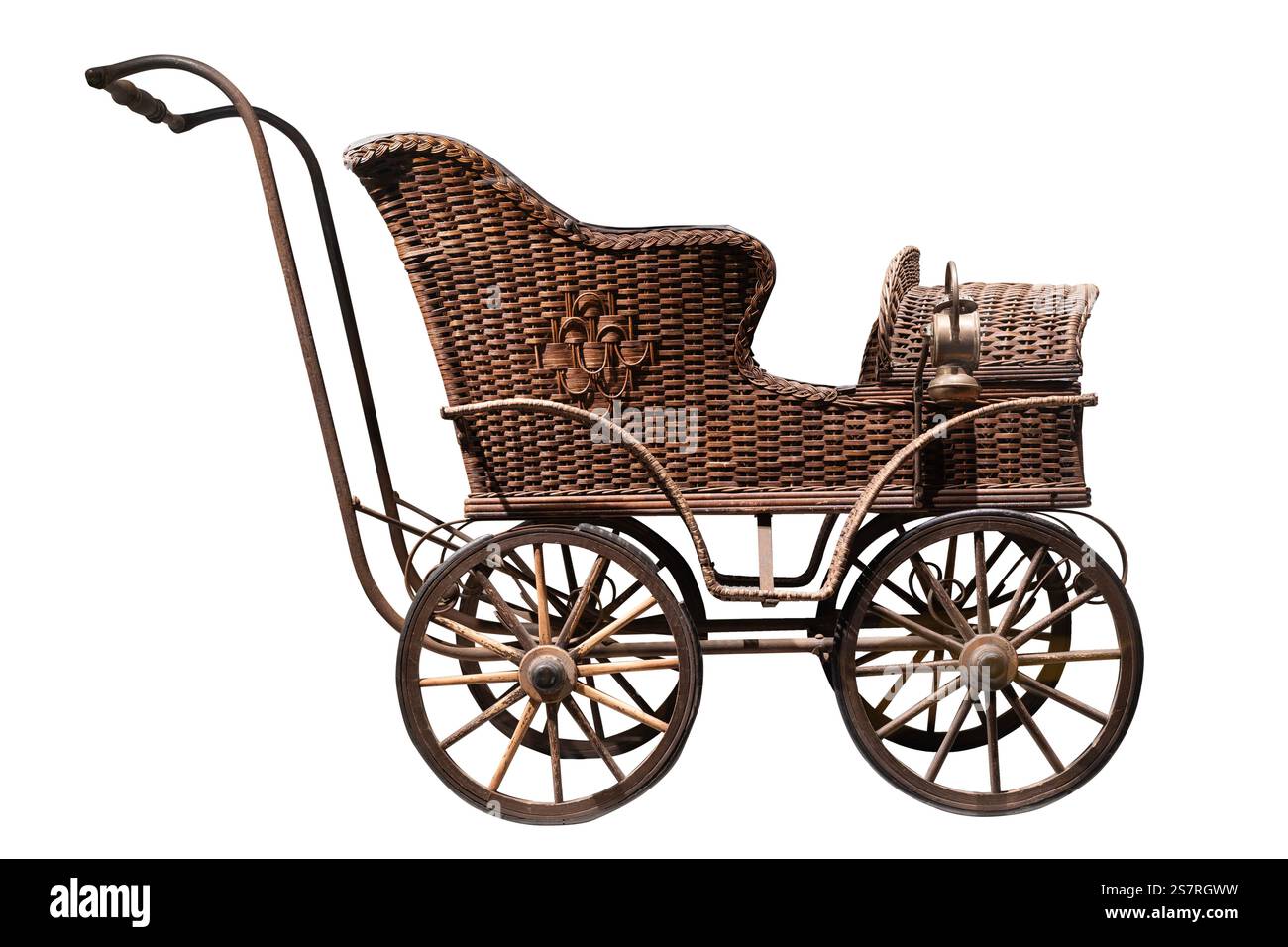 A detailed view of a vintage wicker baby carriage with metal wheels ...