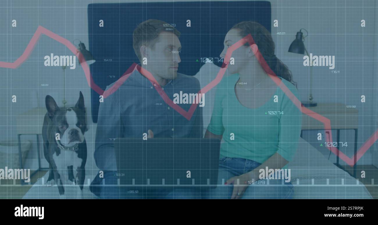 Financial graph image over couple with laptop and dog on bed Stock ...