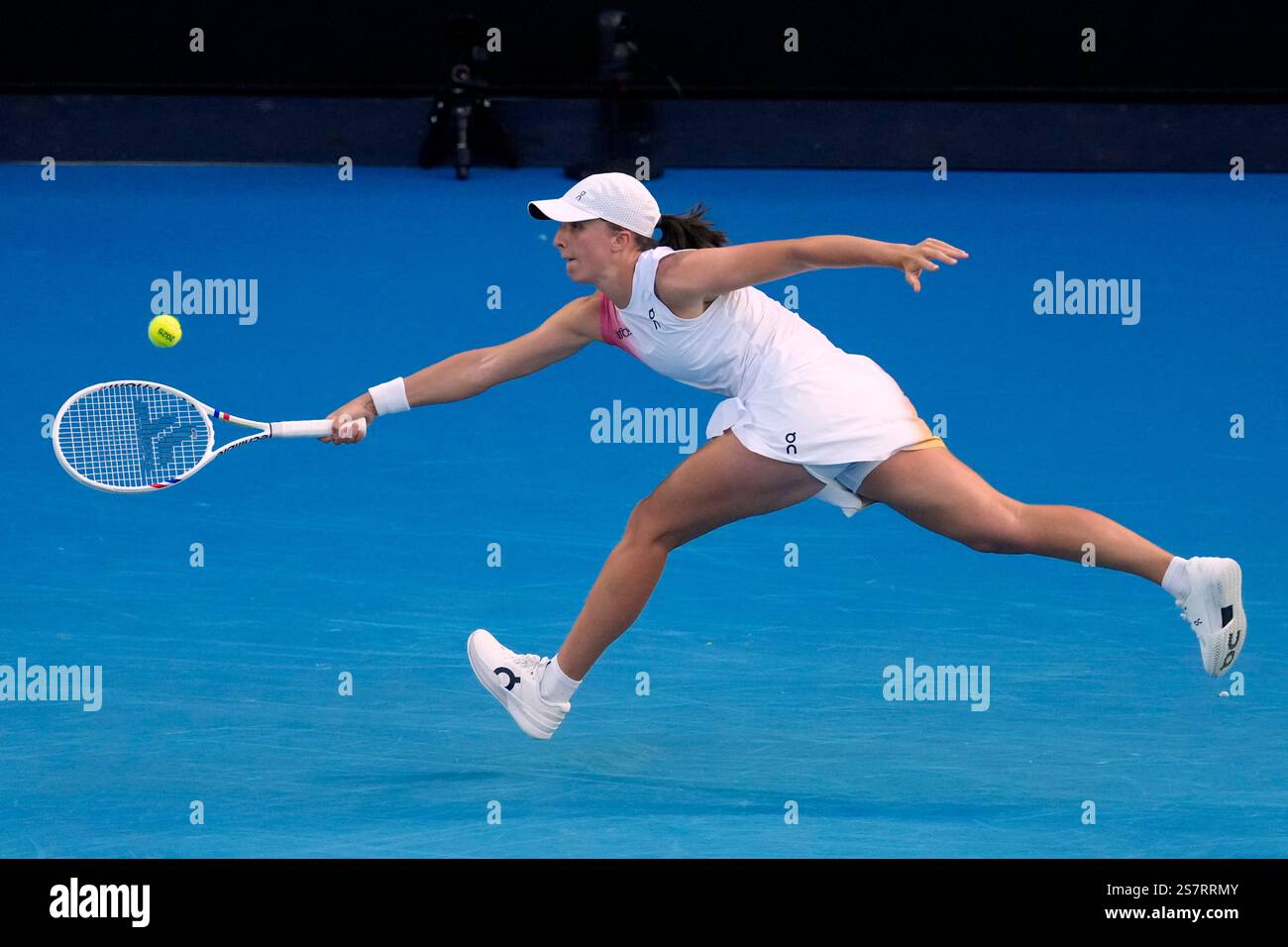 Iga Swiatek of Poland plays a forehand return to Eva Lys of Germany ...
