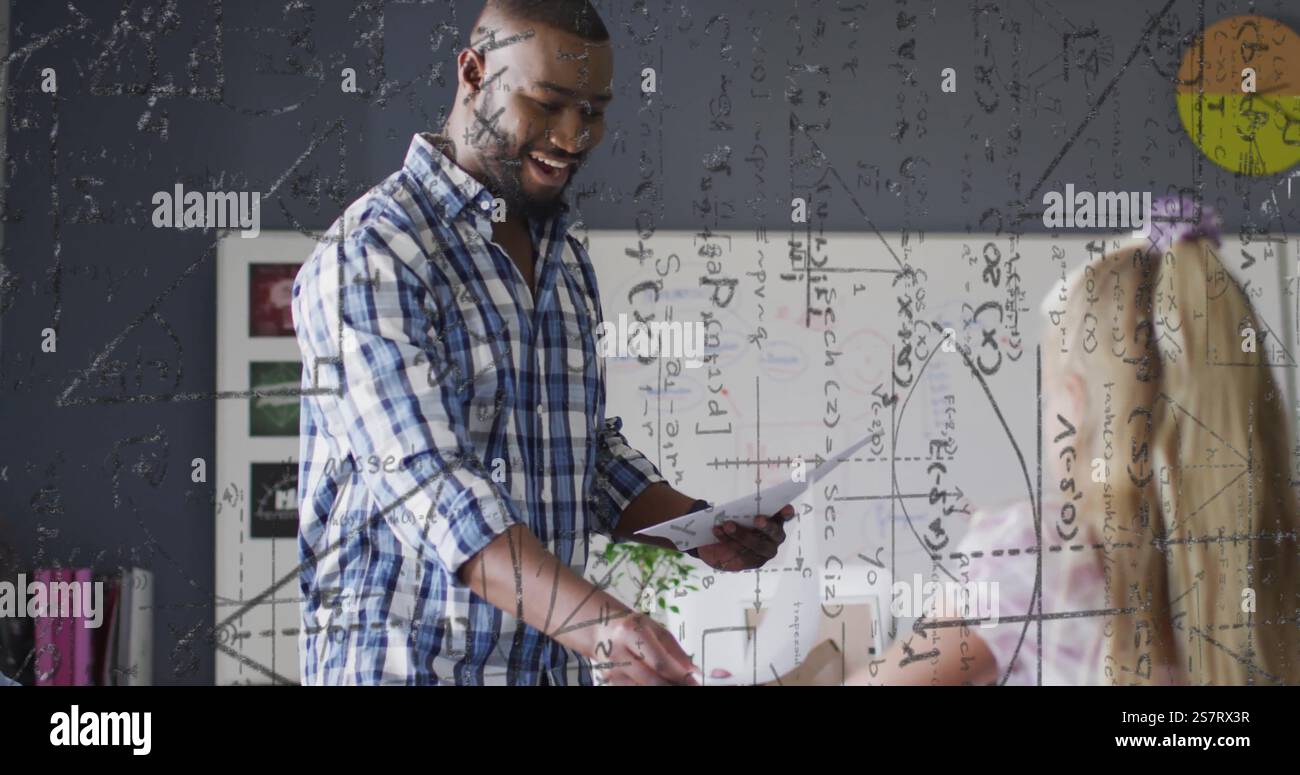 Image of mathematical equations over african american male teacher ...