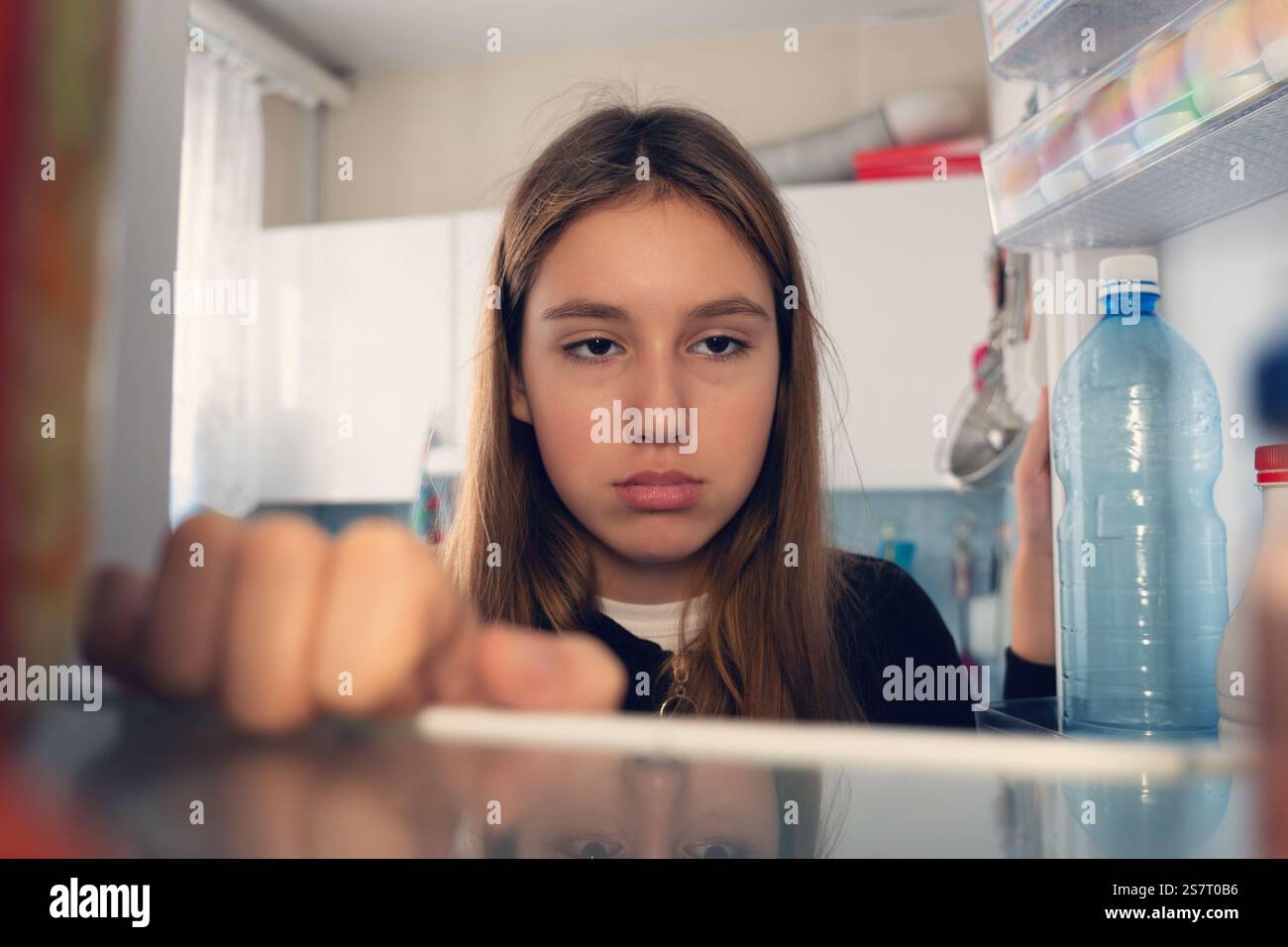 POV point of view from inside refrigerator Caucasian hungry girl adult ...