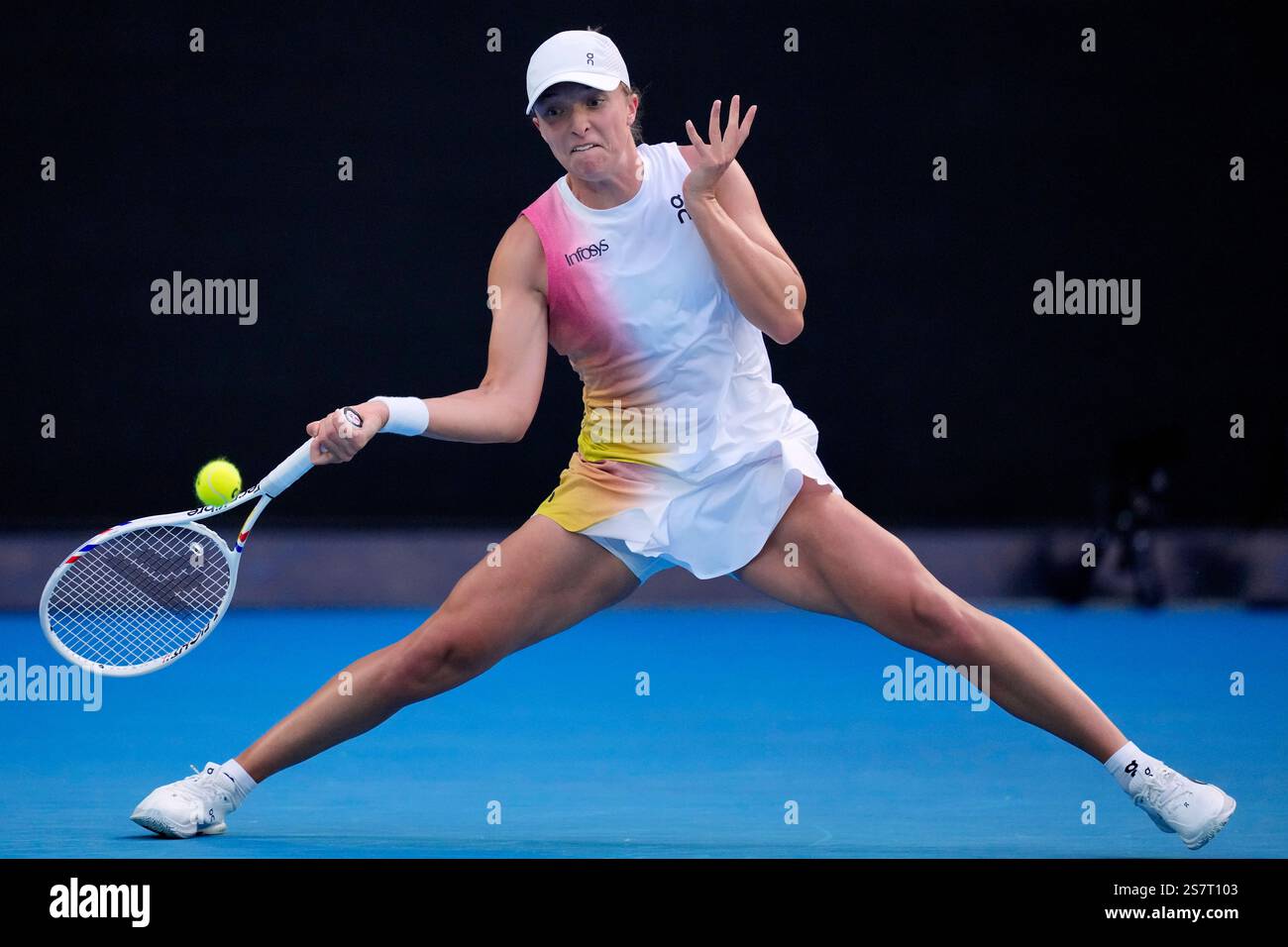 Iga Swiatek of Poland plays a forehand return to Eva Lys of Germany ...