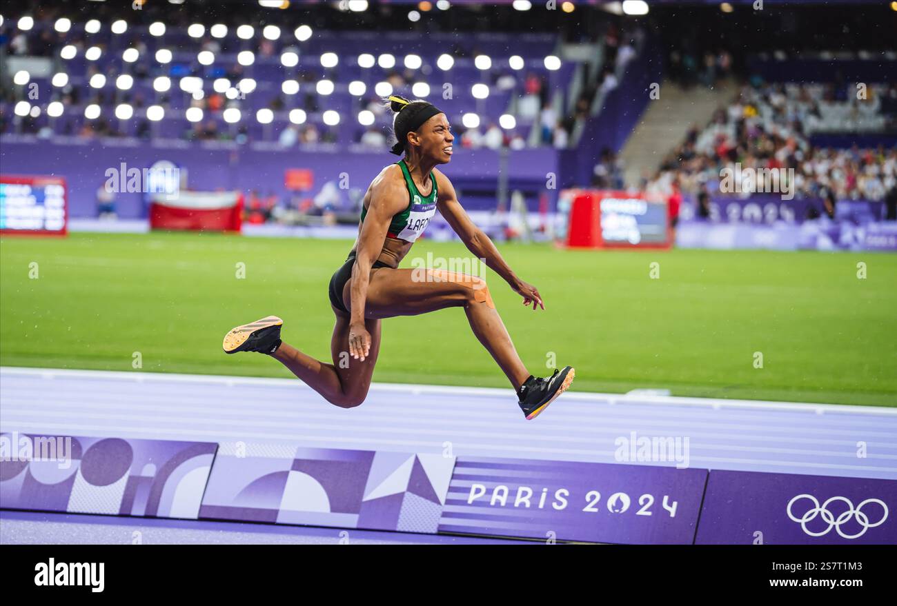 Thea LaFond celebrating her medal with her country's flag at the Paris ...