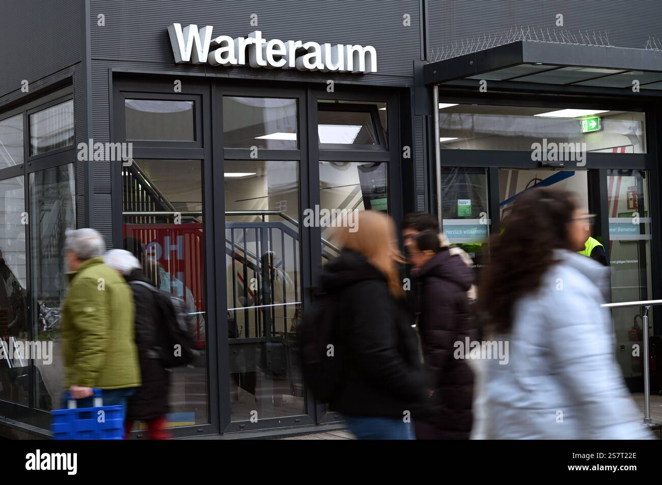 Stuttgart, Germany. 20th Jan, 2025. Passers-by walk past a waiting room ...