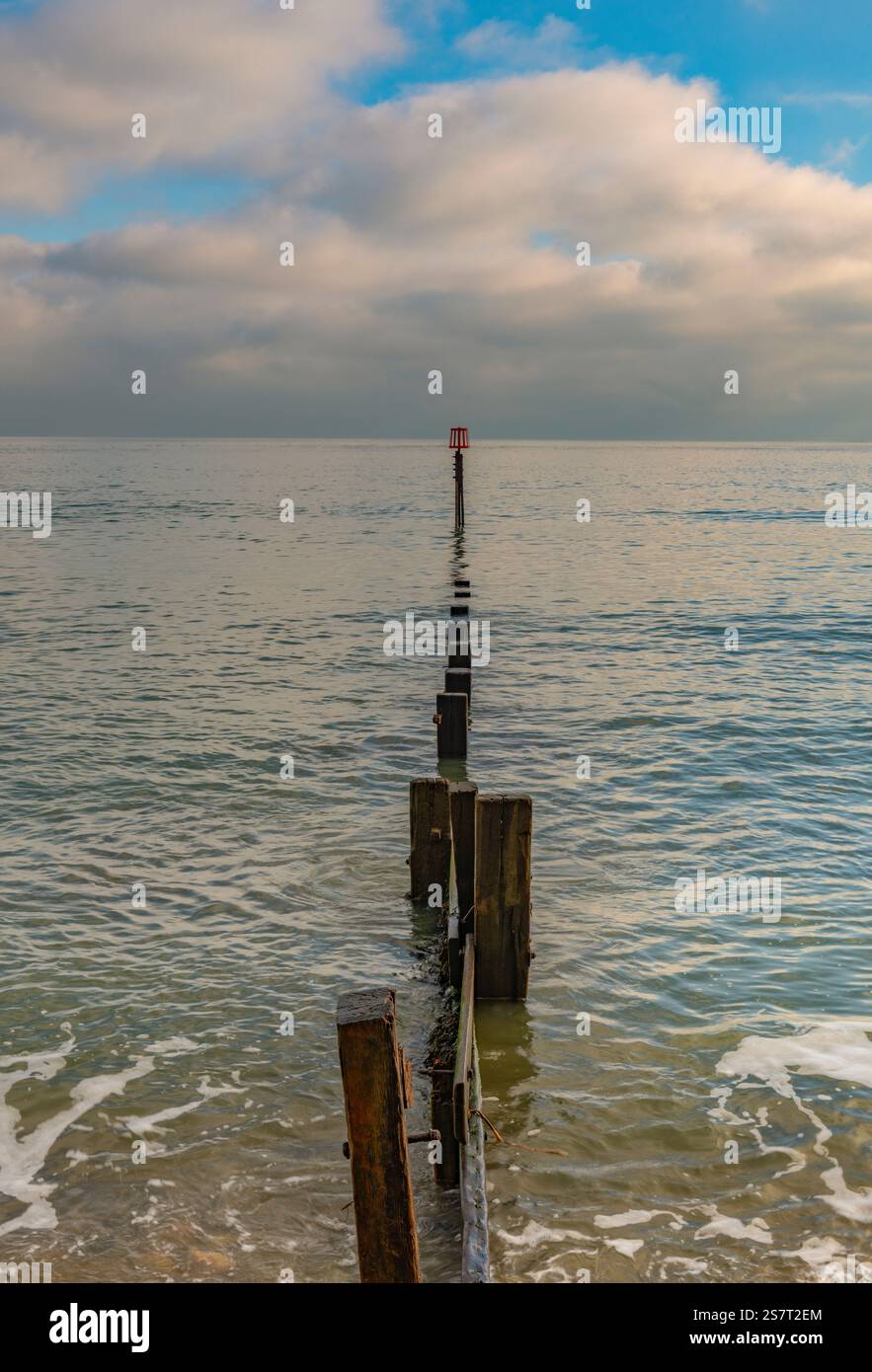 old wooden groyne or breakwater on a beach at Shanklin on the isle of ...