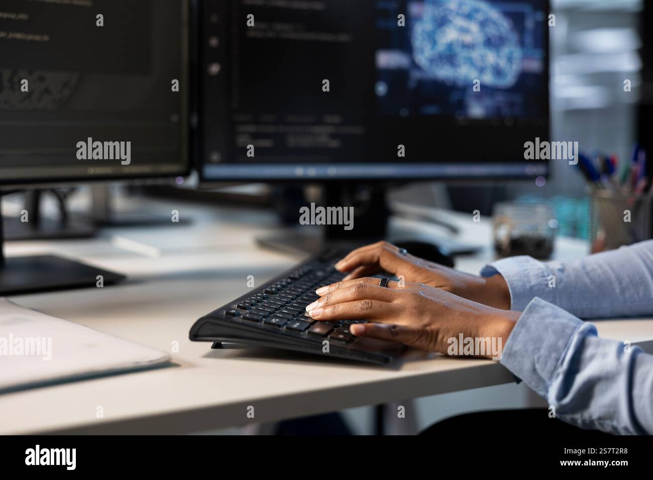 Engineer typing on keyboard in server hub, monitoring data center energy consumption using AI ...