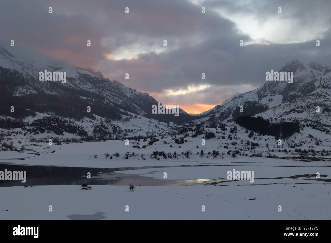 Breathtaking winter sunset with vibrant colors illuminating the snowy ...
