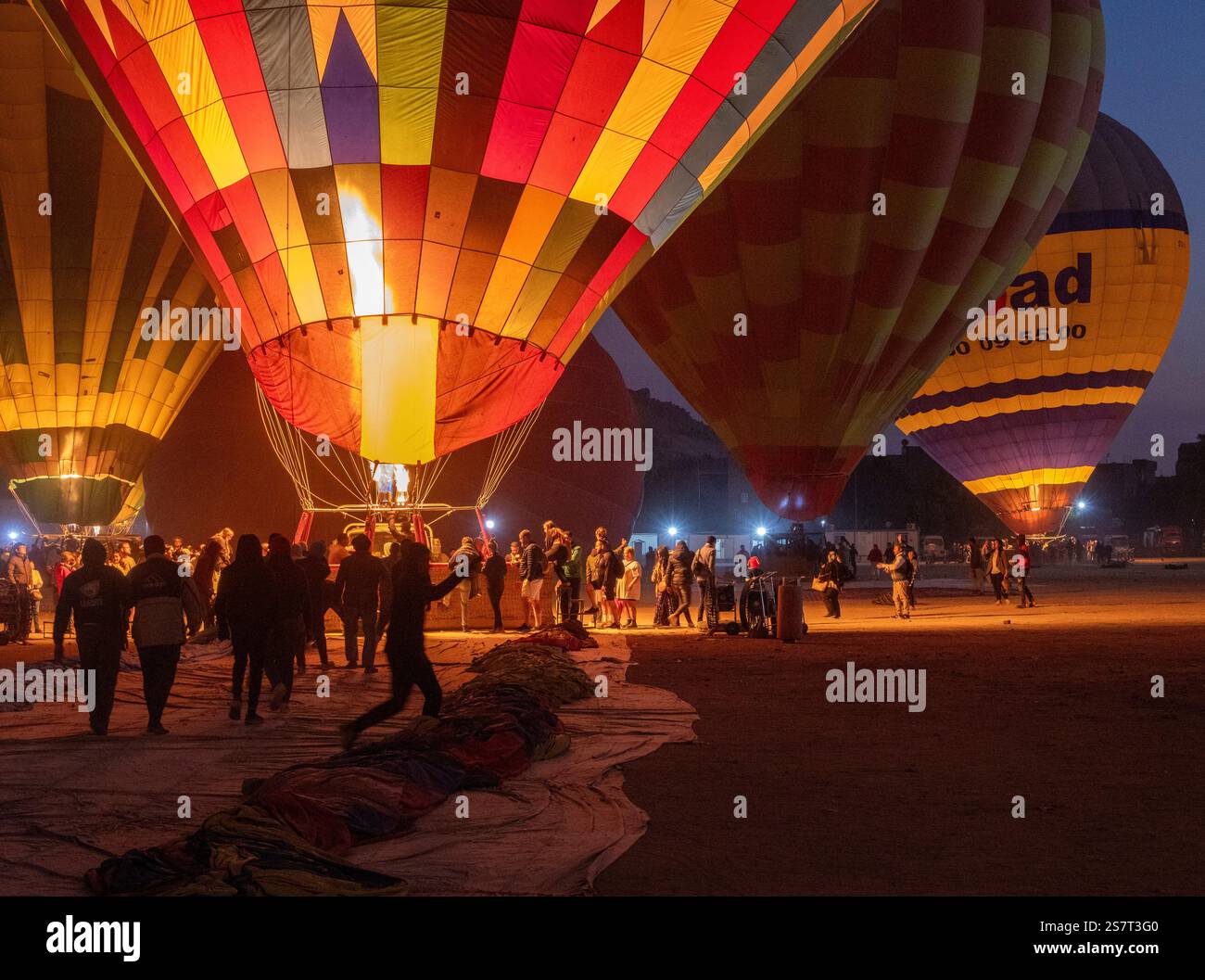 pre-dawn inflation of hot-air balloon, Thebes, Luxor, Egypt Stock Photo ...