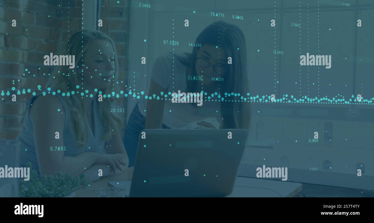 Data visualization image over two women working on laptop in office ...