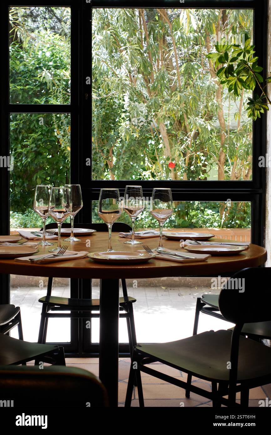 Vertical view of restaurant table prepared and empty, with unused ...