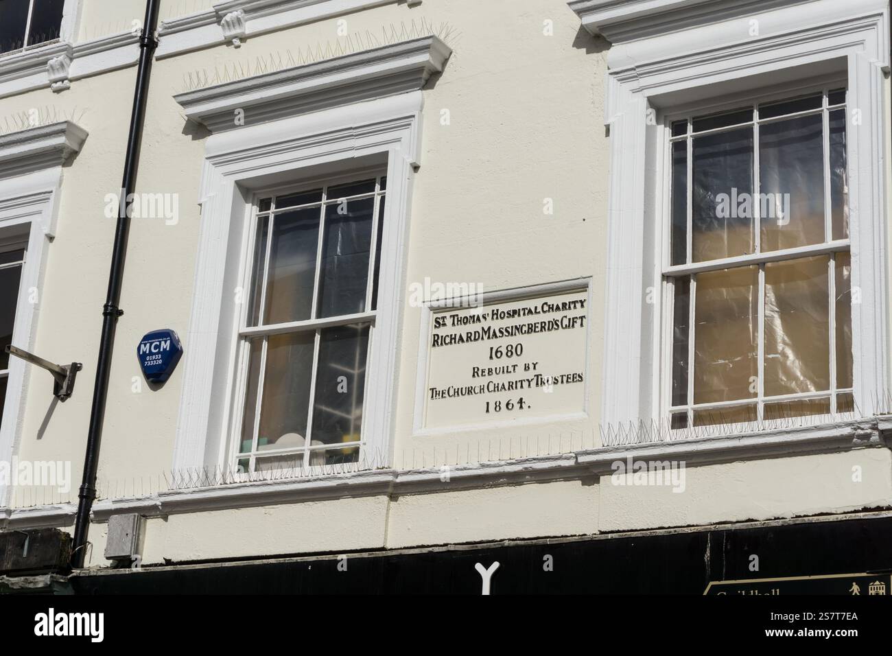 Signage for the 17th century former St Thomas Hospital Charity building ...