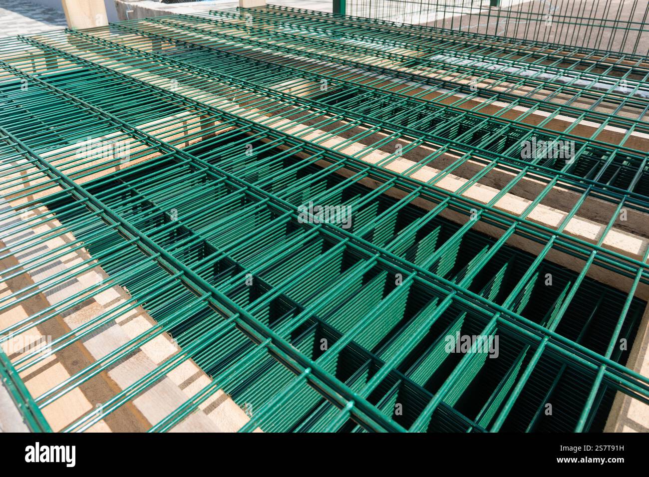Close up top view of factory packaging with metal lattice fencing ...