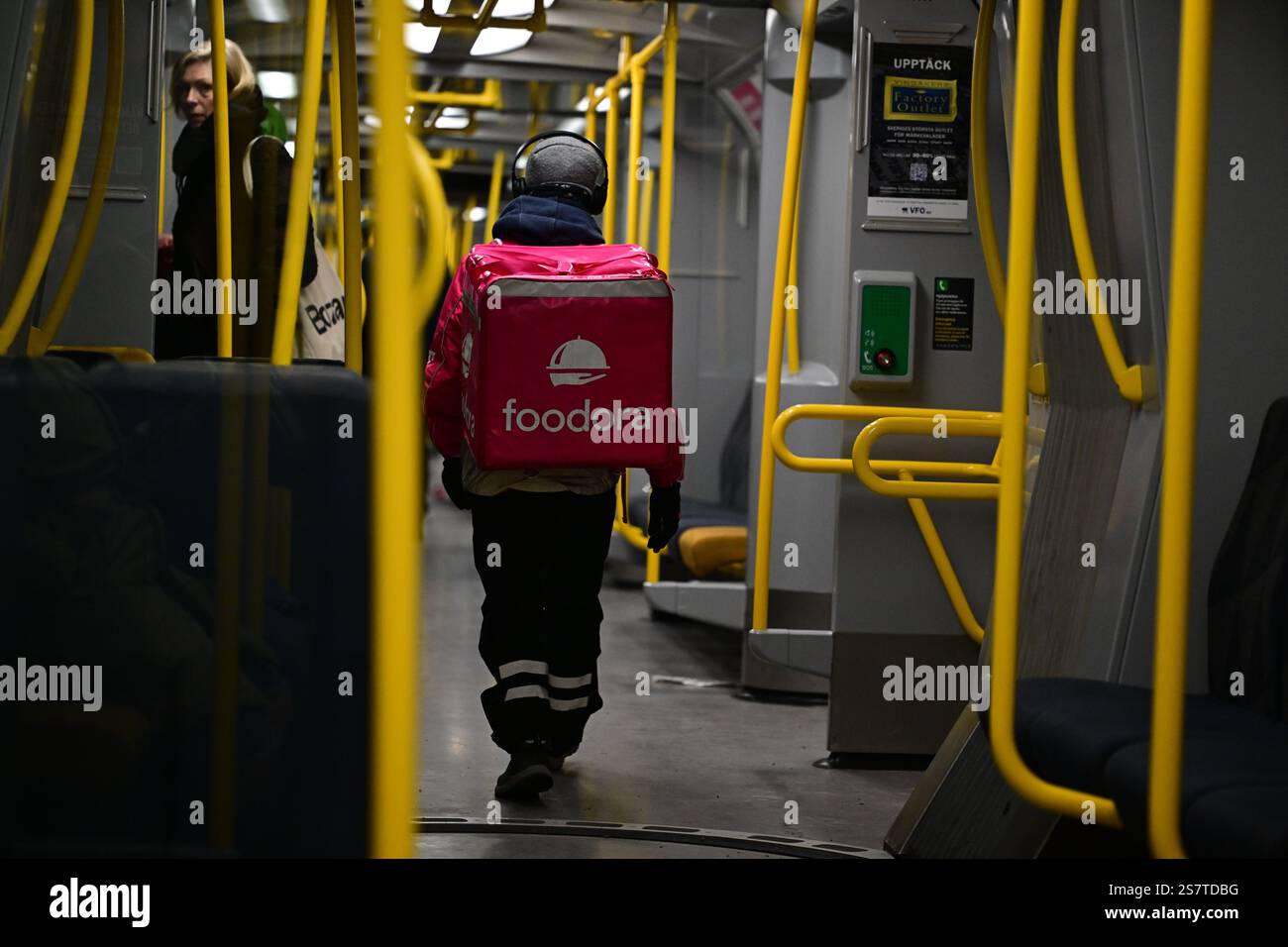 Stockholm, Uppland, Sweden. January 1 2025. Foodora delivery driver on ...