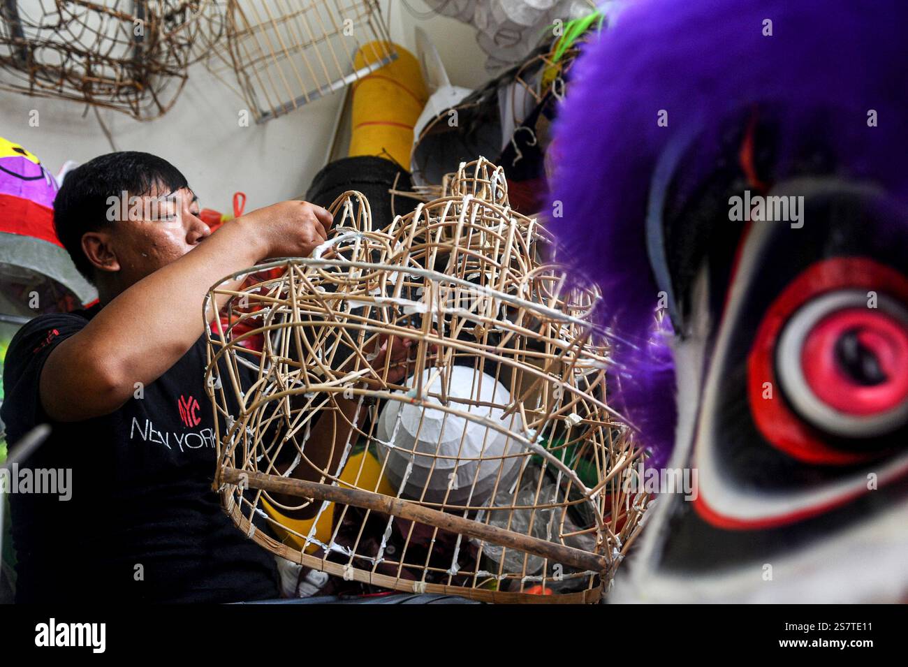 Sidoarjo, Indonesia. 20th Jan, 2025. A worker makes a lion dance prop ...