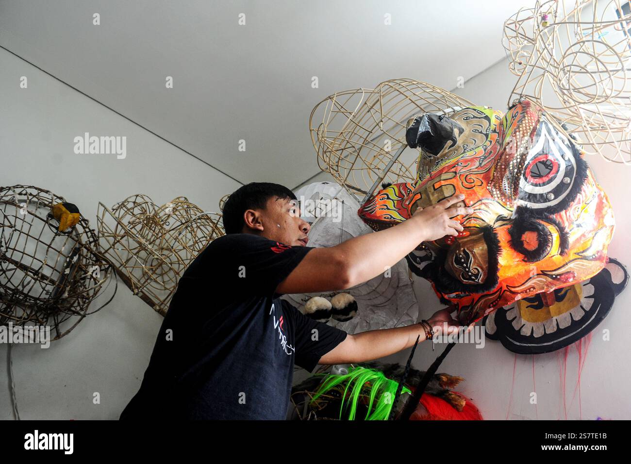 Sidoarjo, Indonesia. 20th Jan, 2025. A worker makes a lion dance prop ...