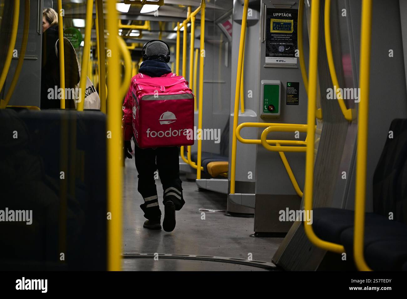 Stockholm, Uppland, Sweden. January 1 2025. Foodora delivery driver on ...