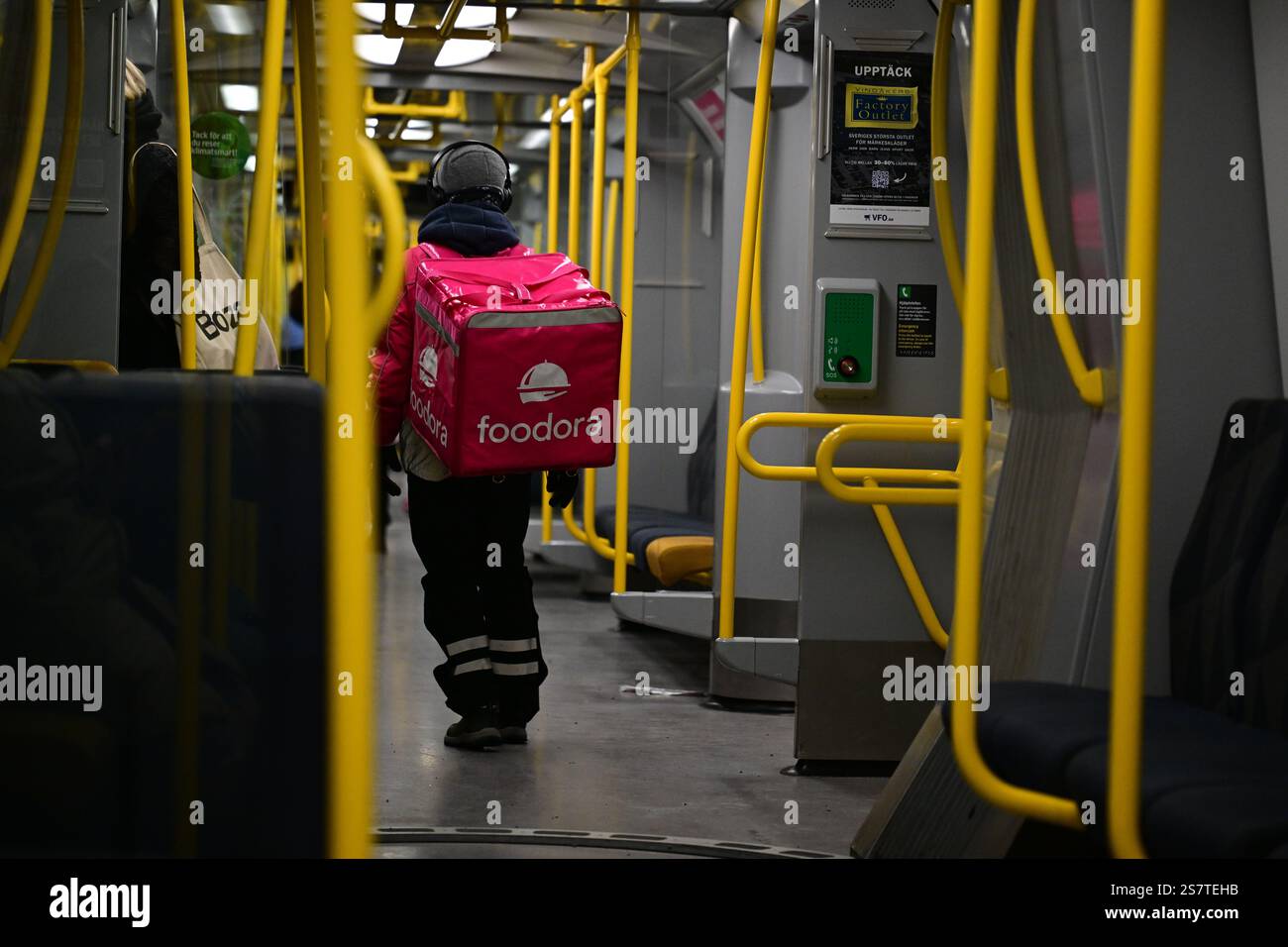 Stockholm, Uppland, Sweden. January 1 2025. Foodora delivery driver on ...