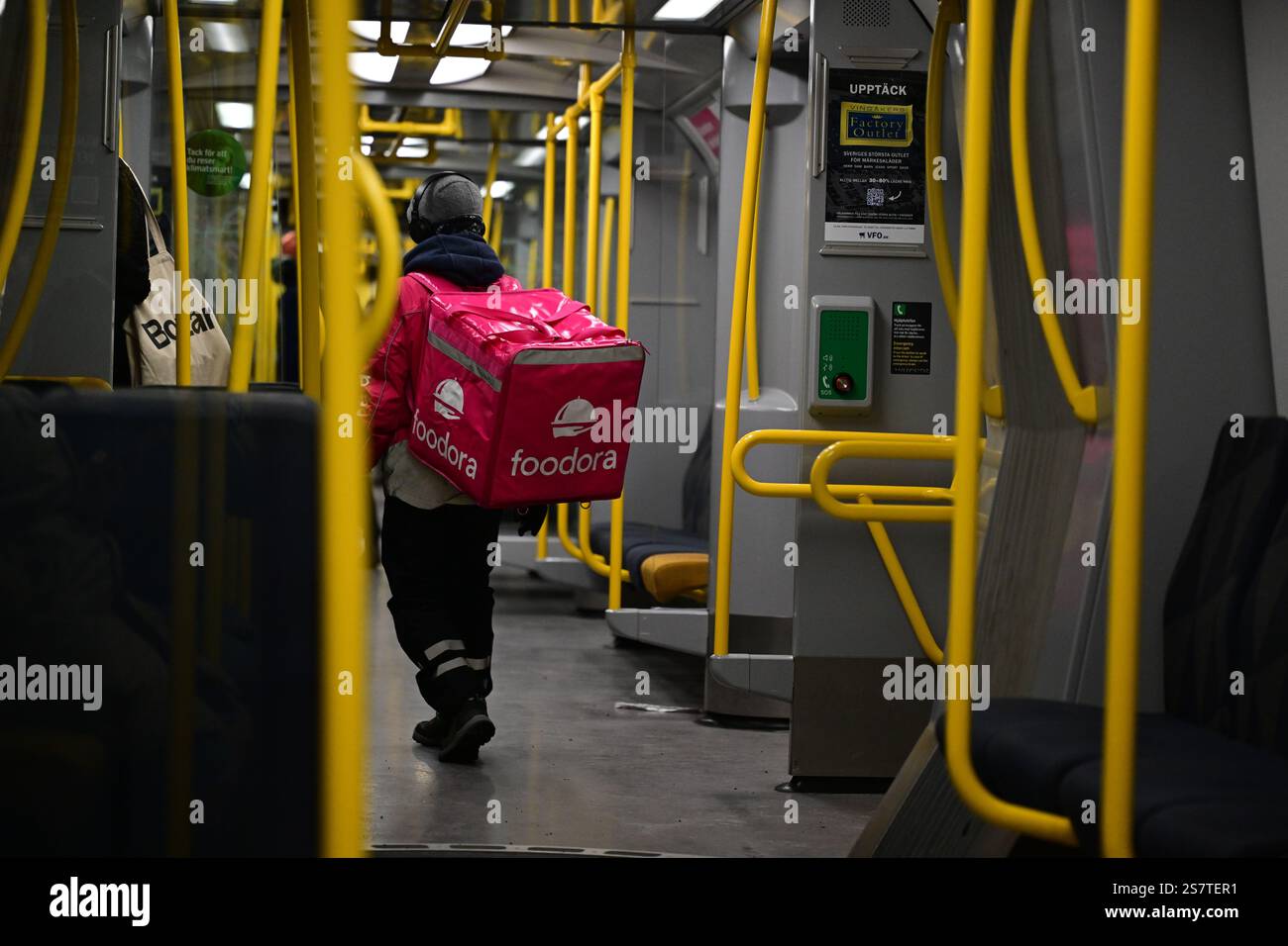 Stockholm, Uppland, Sweden. January 1 2025. Foodora delivery driver on ...