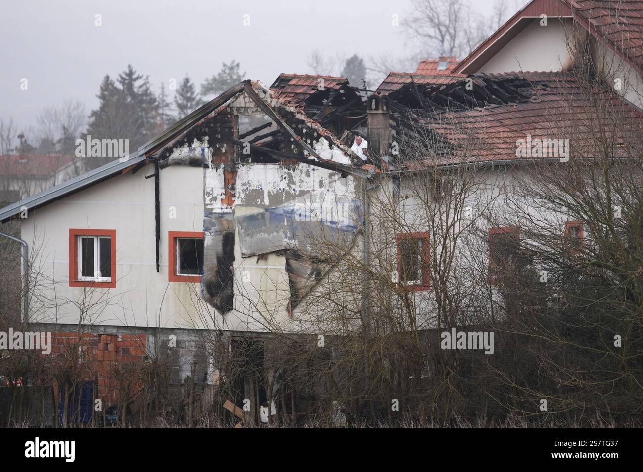 Police officers inspect a home for the elderly where eight people died ...