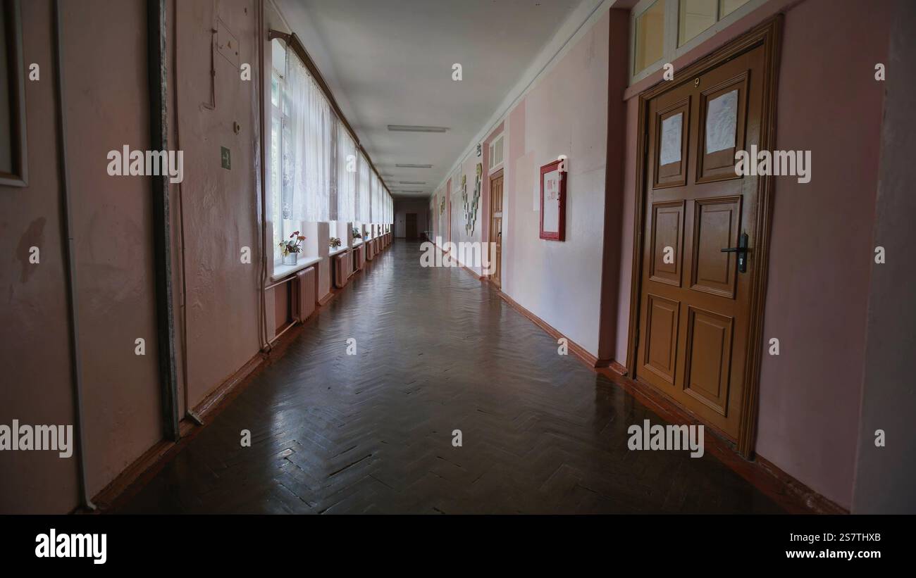 Quiet school hallway with closed doors and soft lighting brings back ...