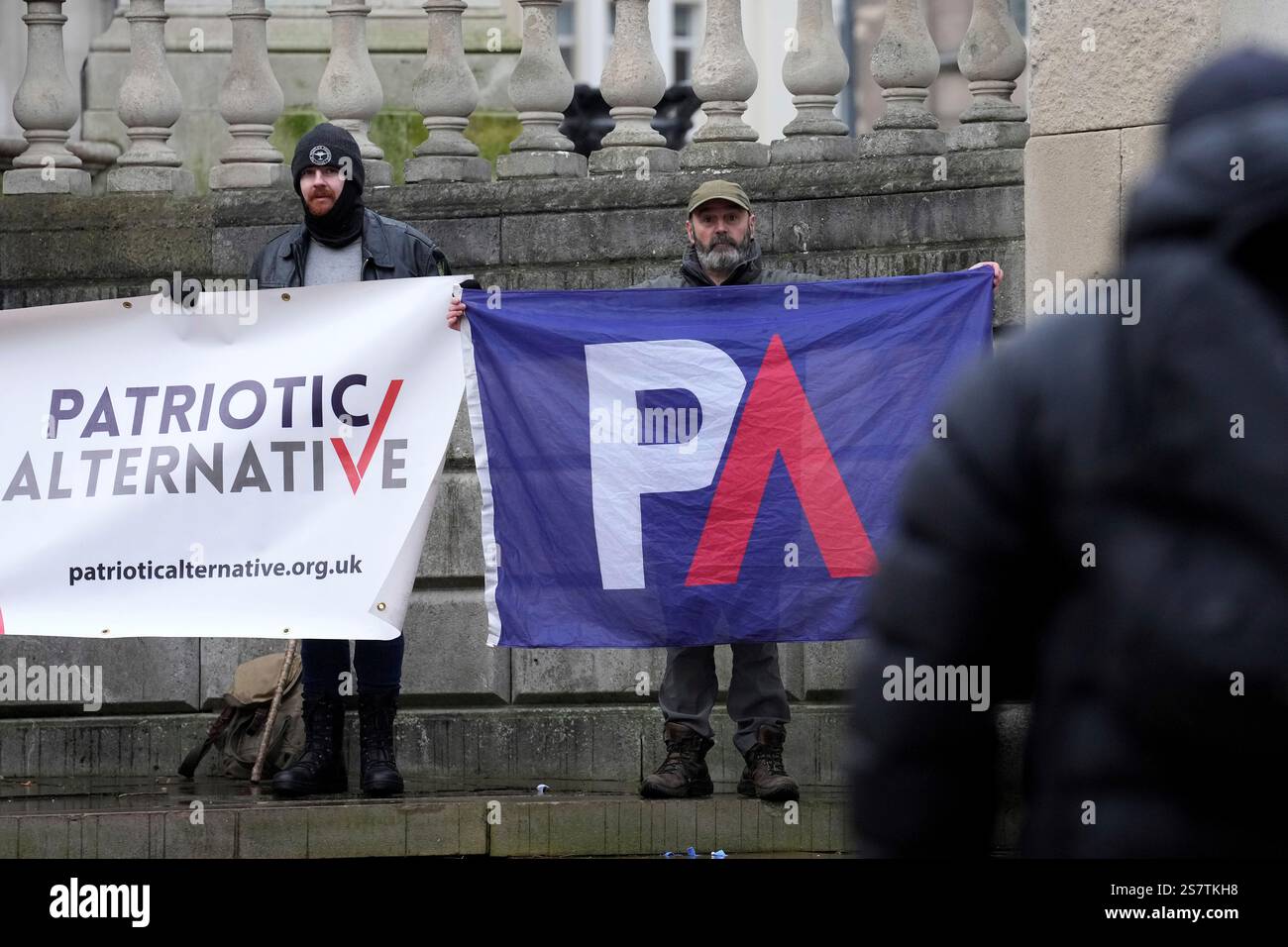Protesters hold banners near Liverpool Crown Court in Liverpool ...