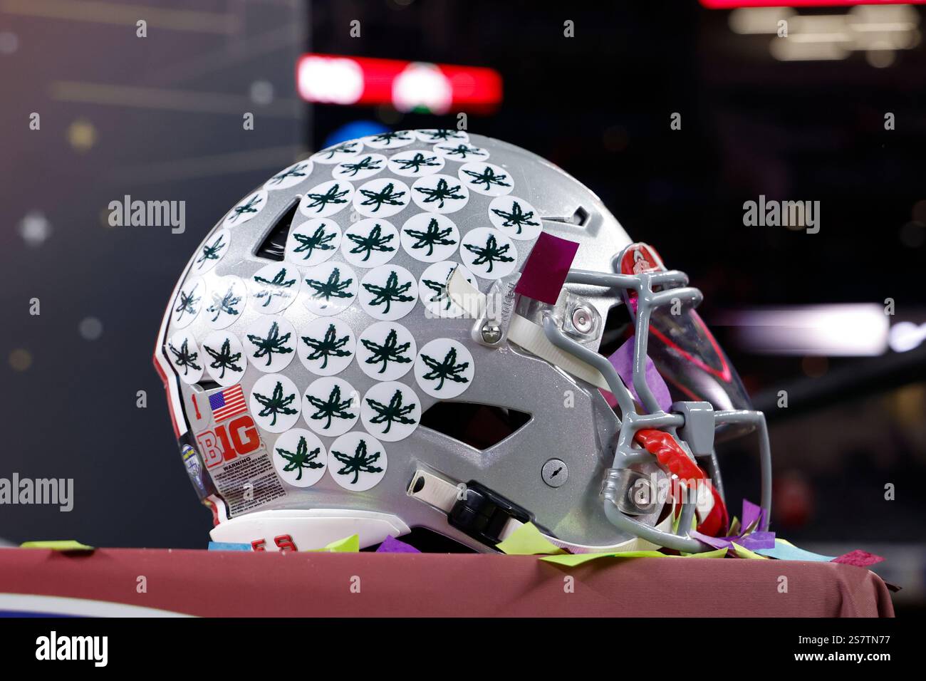 A closeup view of a Ohio State helmet among confetti after the NCAA CFP ...