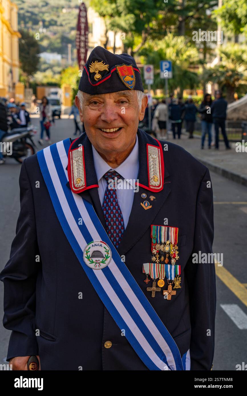 An Italian military veteran with his medals after a war memorial ...