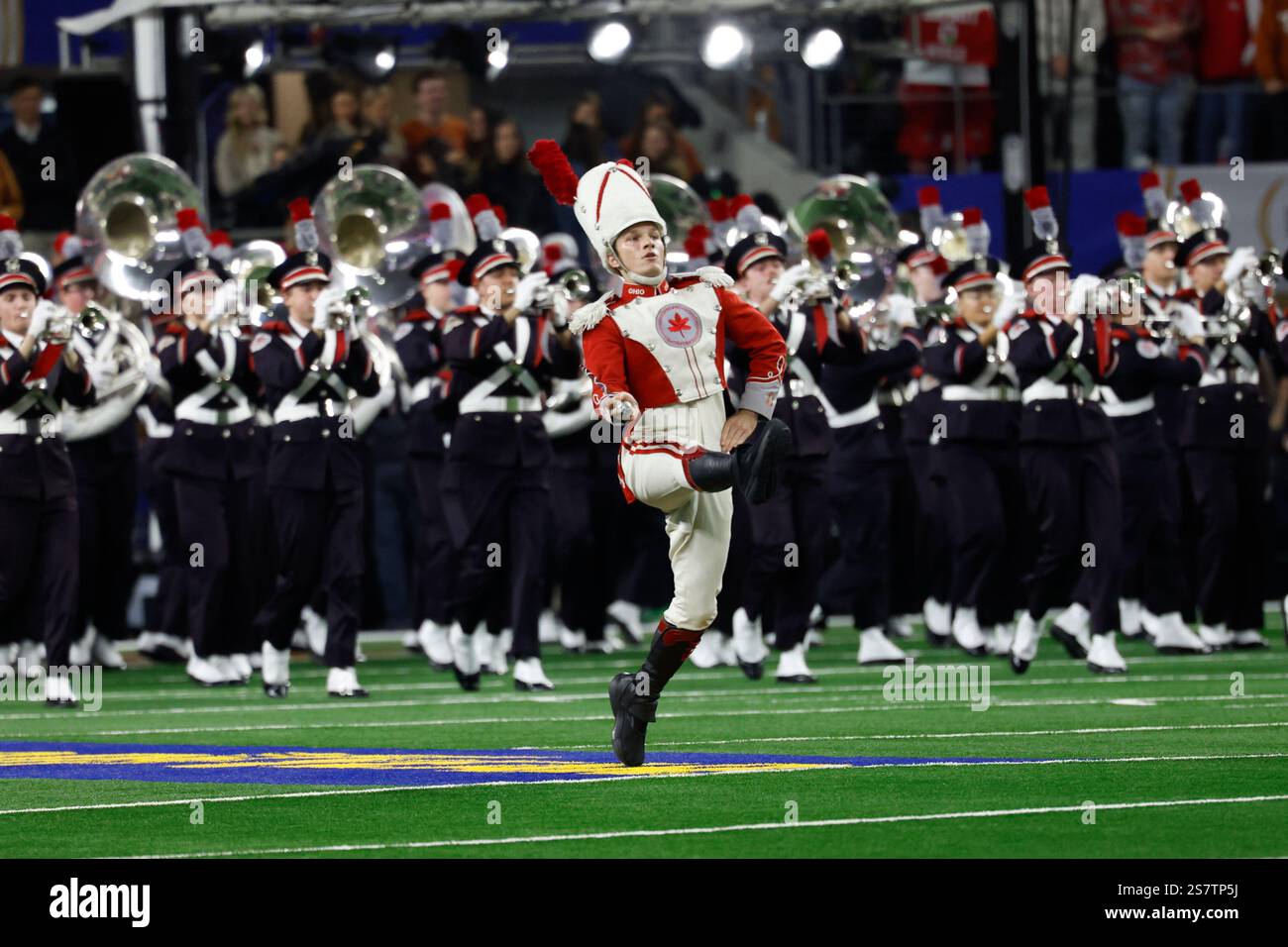 Ohio State University marching band drum major Clayton Callender leads them onto the field for a ...