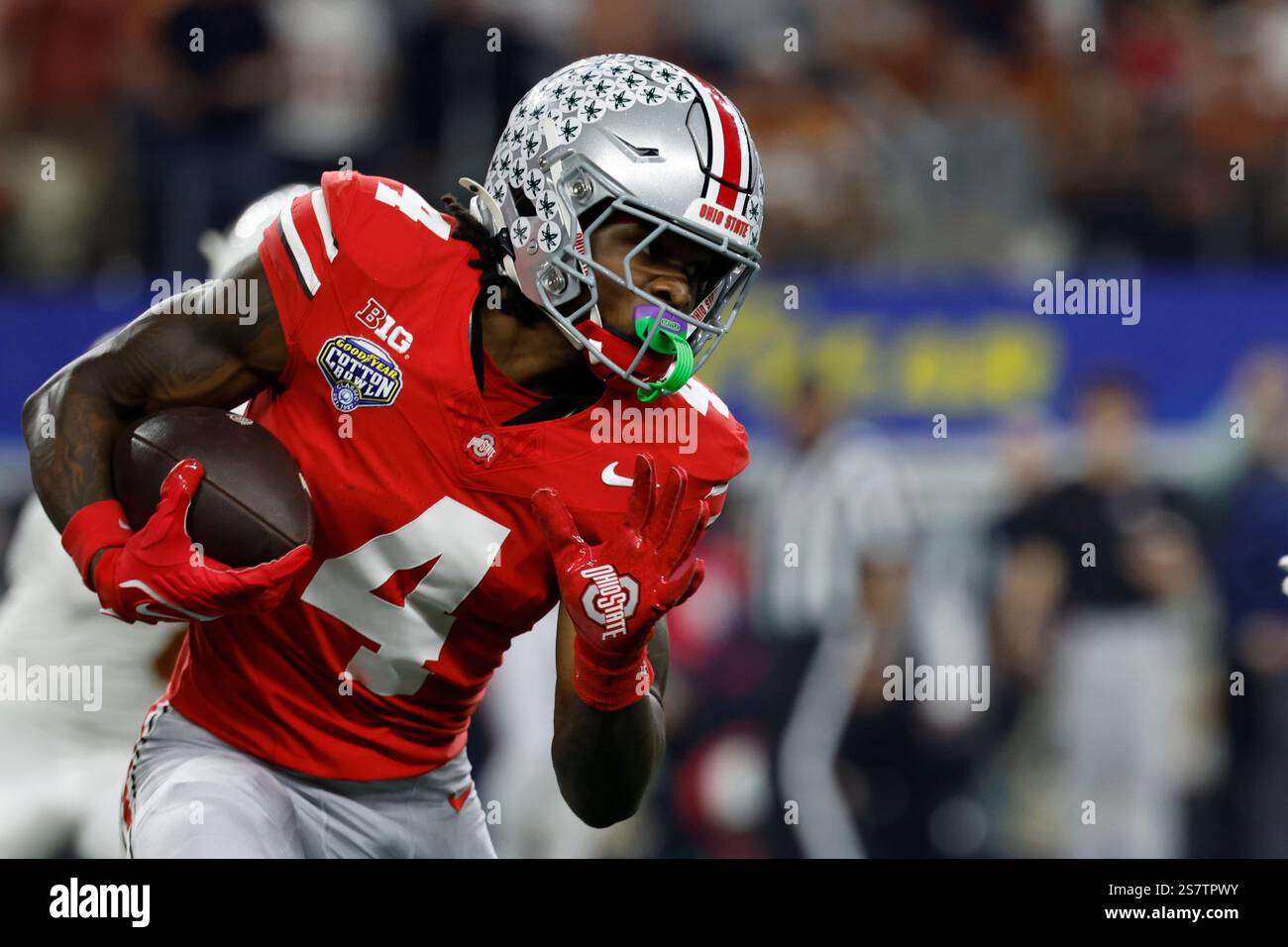 Ohio State wide receiver Jeremiah Smith (4) carries the ball after a ...