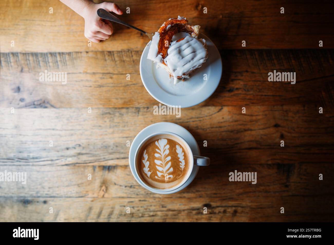Two people-Table top view of latte and cinnamon roll Stock Photo - Alamy