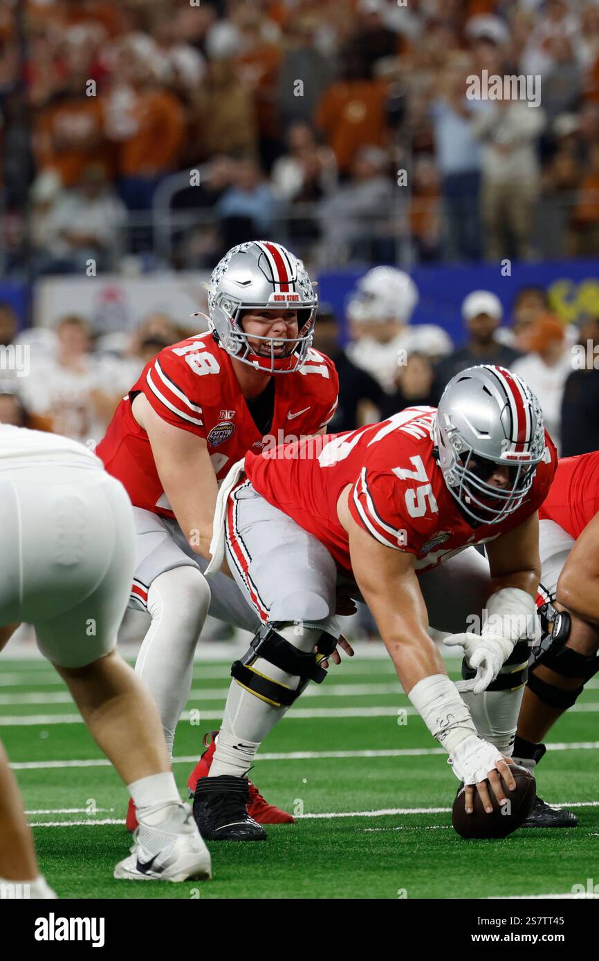 Ohio State quarterback Will Howard (18) lines up under center Carson ...