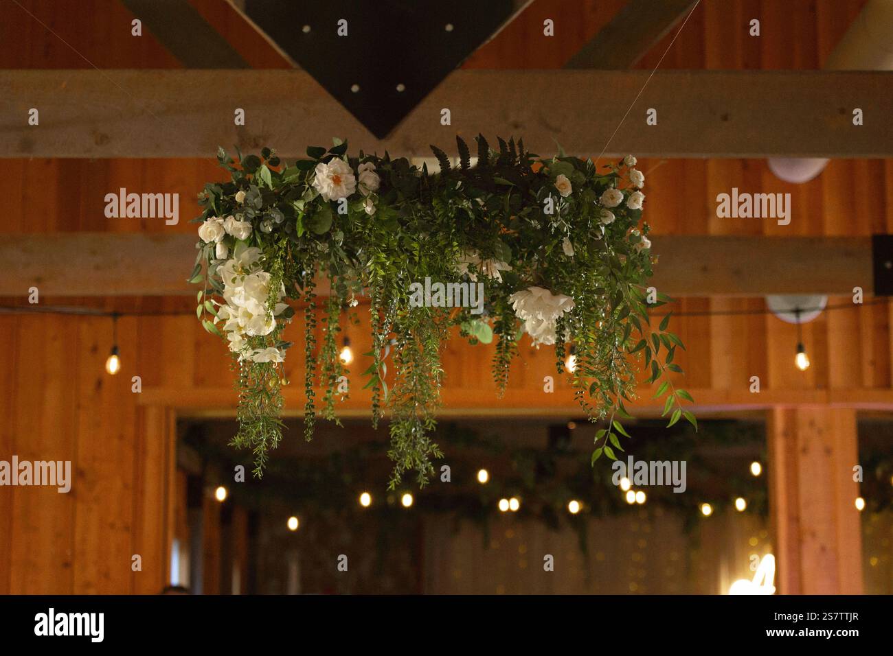 Rustic wedding flowers suspended from the ceiling Stock Photo - Alamy