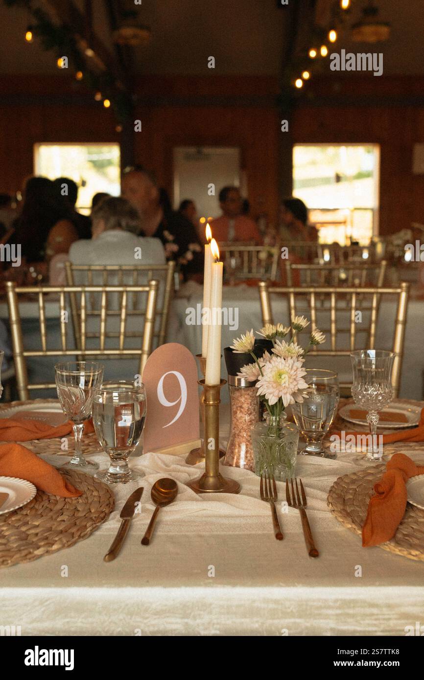 gold boho wedding decor in rustic venue Stock Photo - Alamy